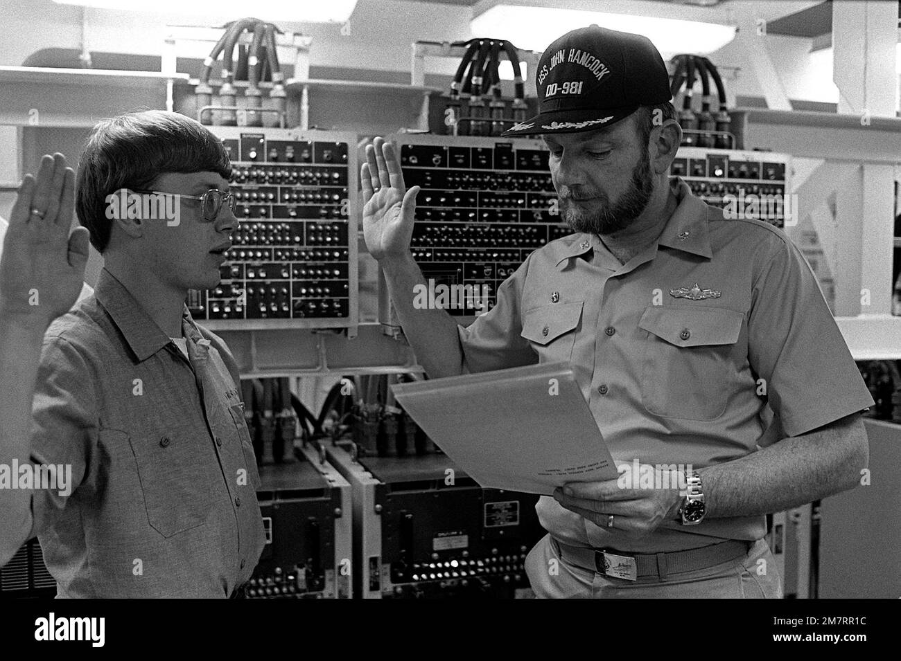 Data Systems Technician 3rd Class Tim Russell re-enlists aboard the ...