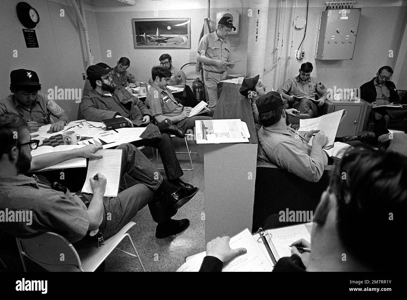 CHIEF petty officers aboard the destroyer USS NICHOLSON (DD-982) study ...