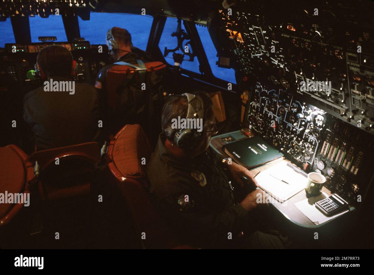 A view of the flight deck of a C-141B Starlifter aircraft during an ...