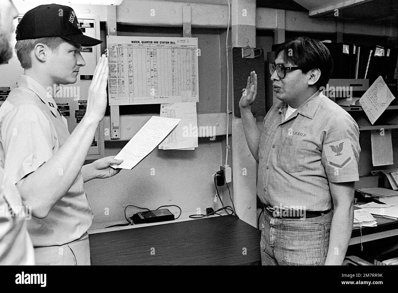 A re-enlistment takes place aboard the destroyer USS JOHN HANCOCK (DD ...