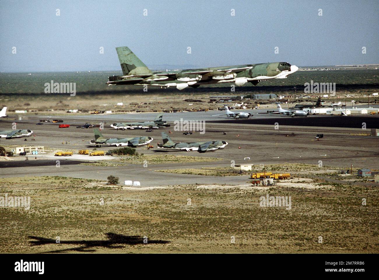 A right side view of a B-52H Stratofortress aircraft taking off during ...