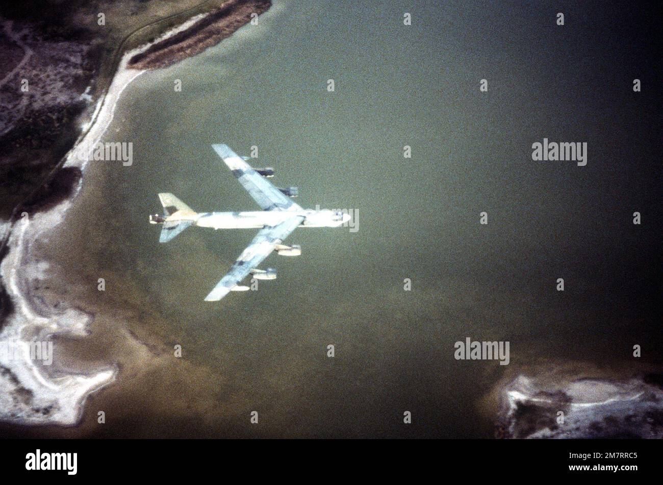 AN air-to-air right side view of a B-52H Stratofortress aircraft over a ...