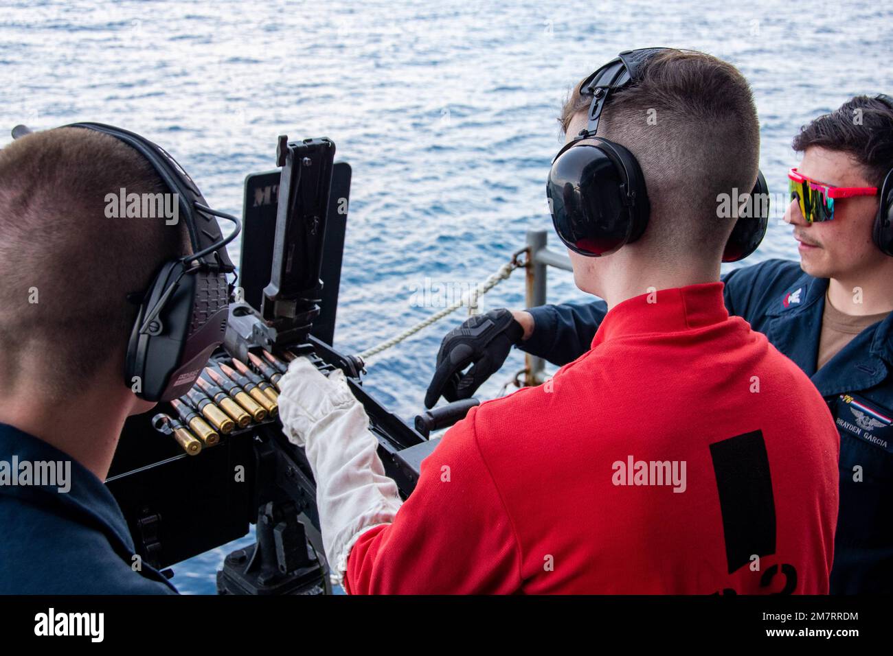 220512-N-BR419-1004 PACIFIC OCEAN (May 12, 2022) Sailors load a .50 ...