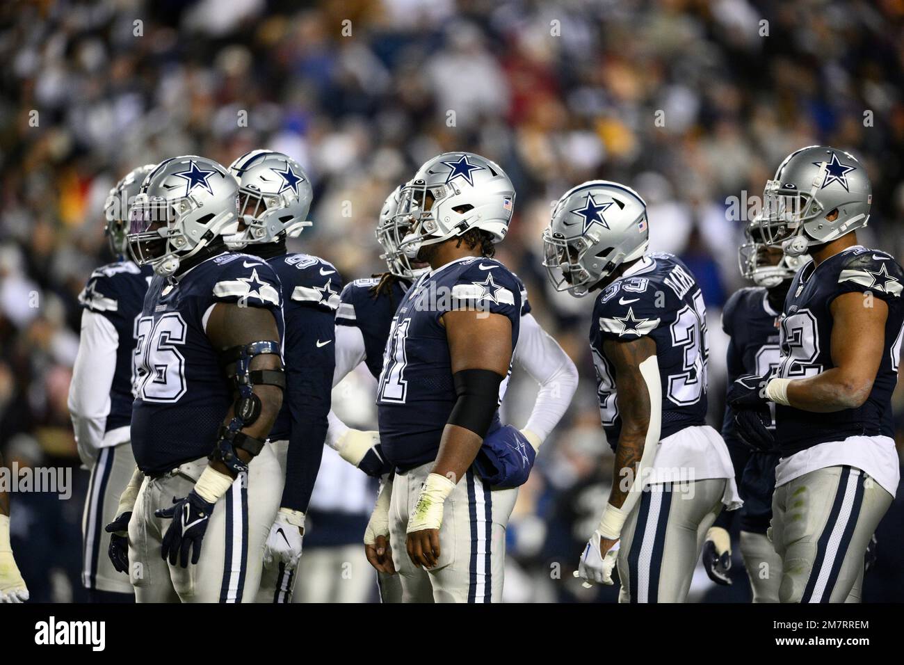 The Dallas Cowboys stand on the field during the first half of an NFL ...