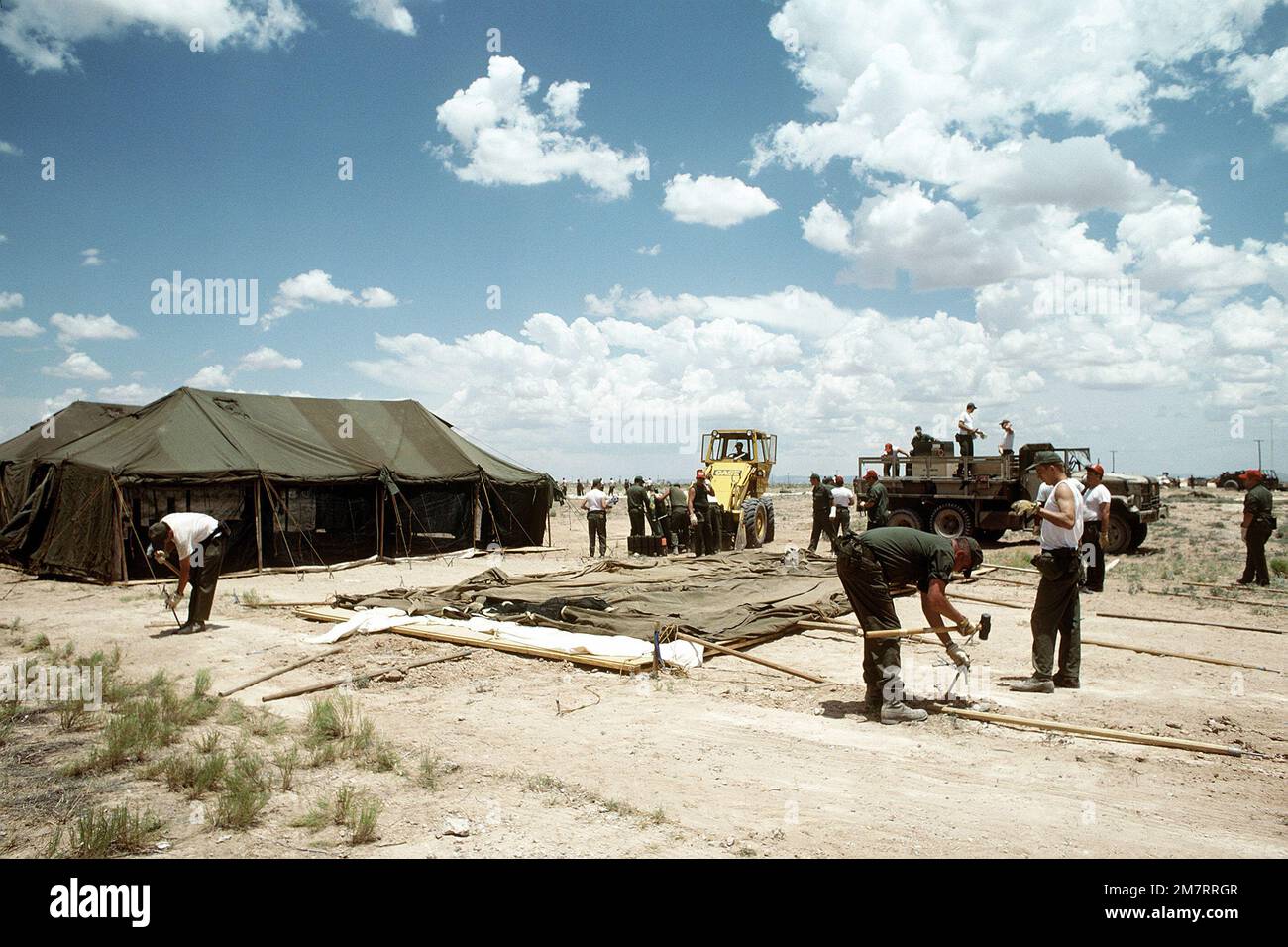 Members of the 3rd Combat Communications Group erect tents on the ...