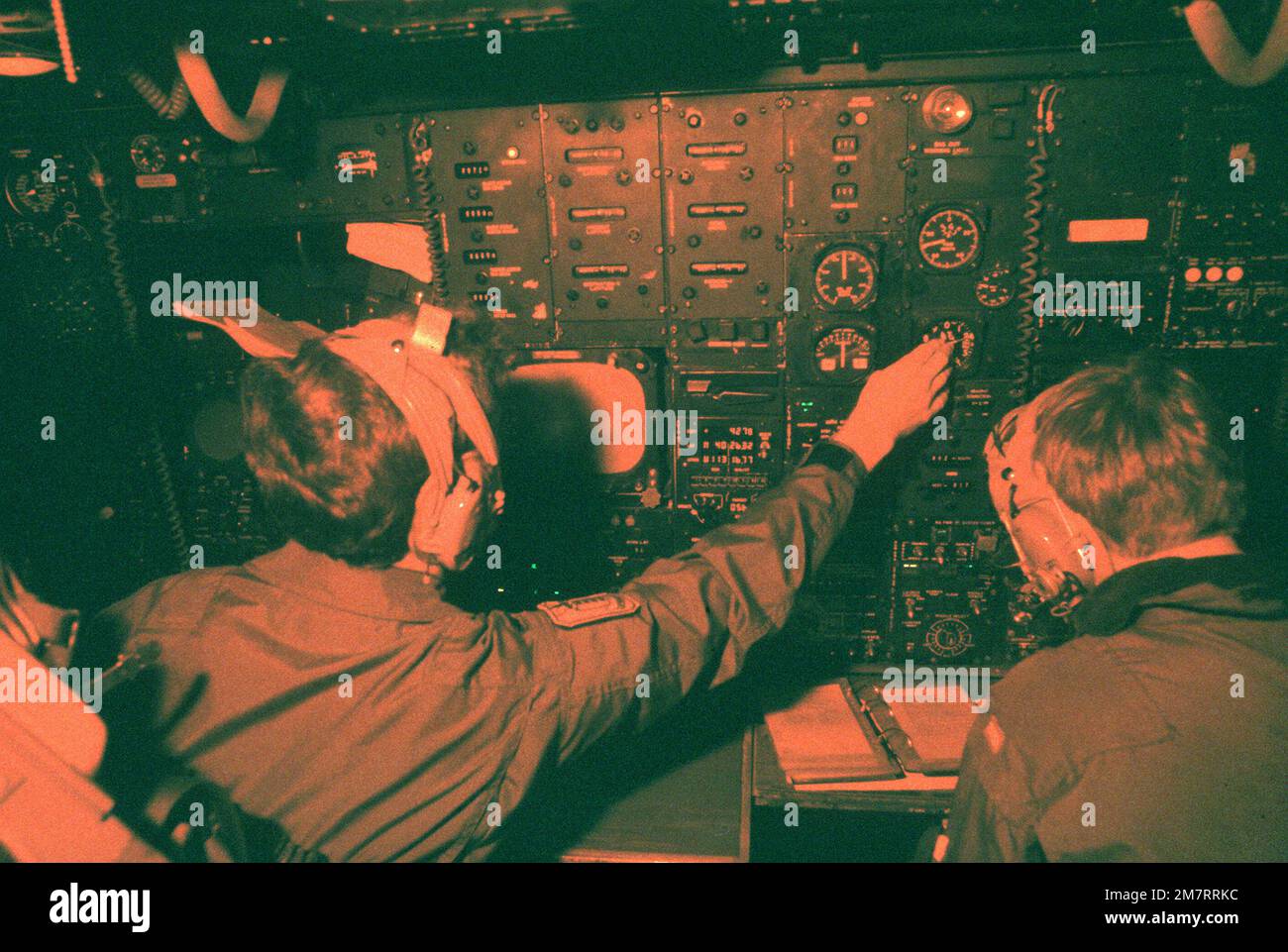 Navigators work in their station aboard a B-52H Stratofortress aircraft ...
