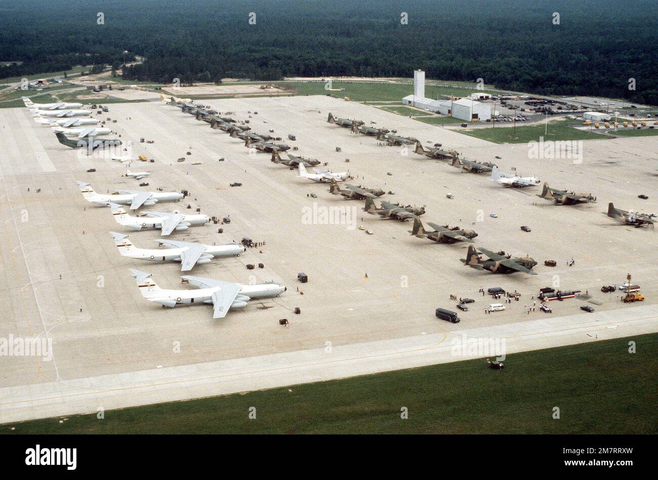 Aerial view of rows of parked aircraft, on the flight line, being used ...