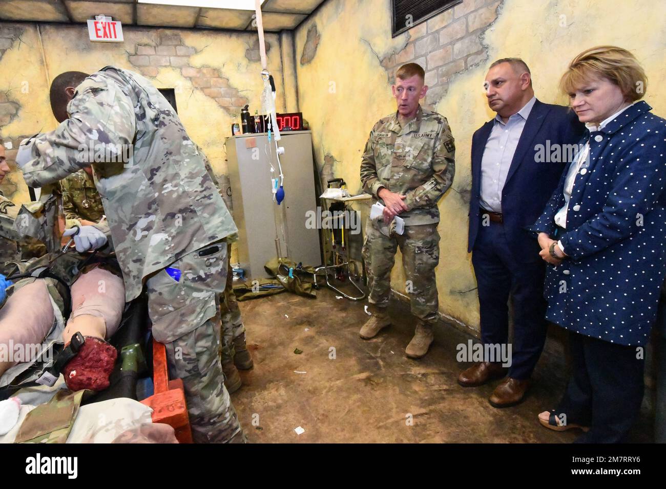The Honorable Gilbert Cisneros Jr., center, Under Secretary of Defense ...
