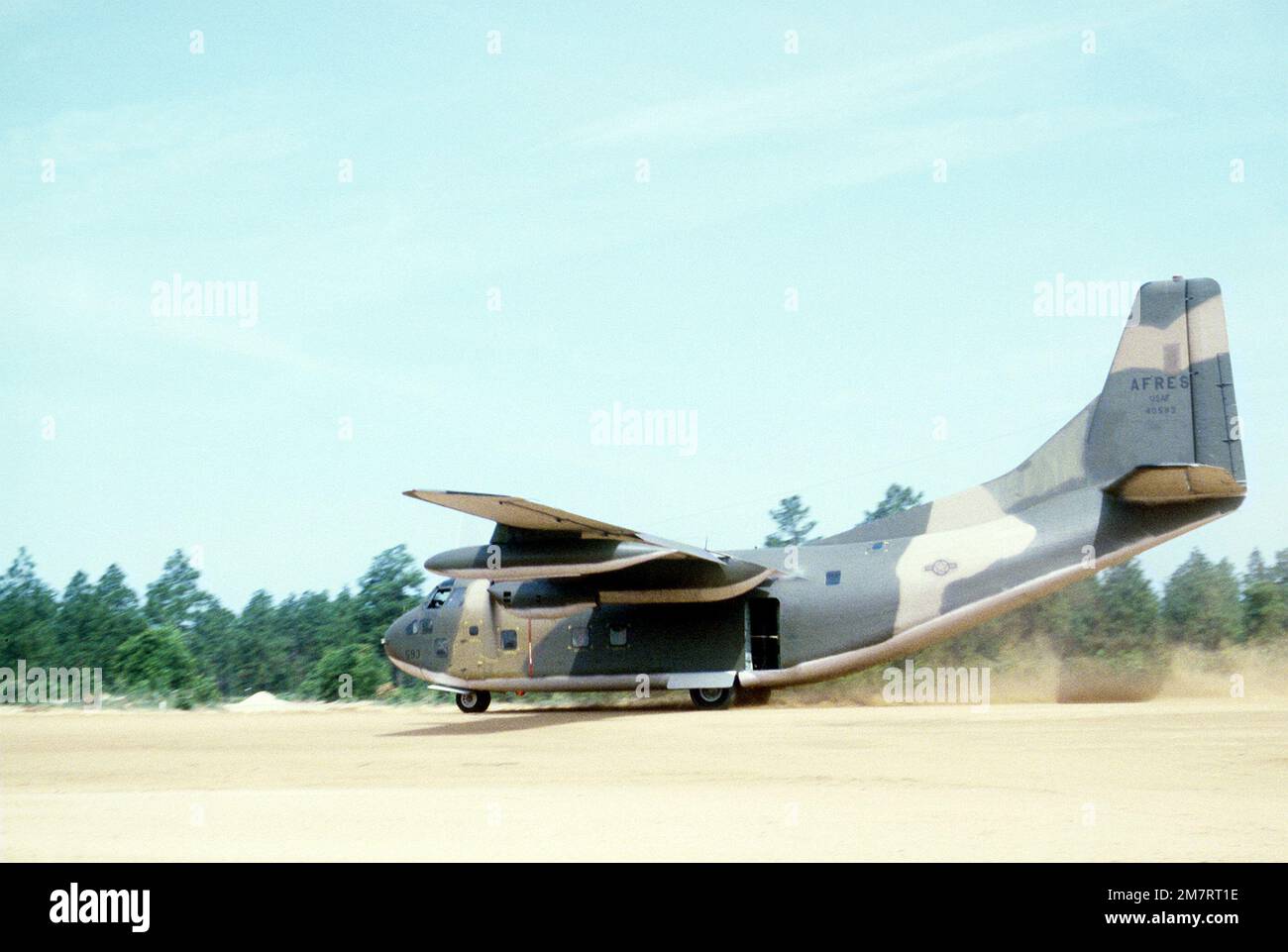 Left side view of a C-123 Provider aircraft during an assault landing ...