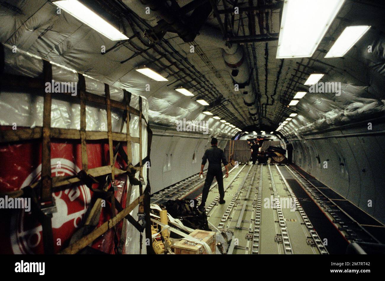 Interior view of a KC-10 Extender aircraft as pallets are moved forward ...