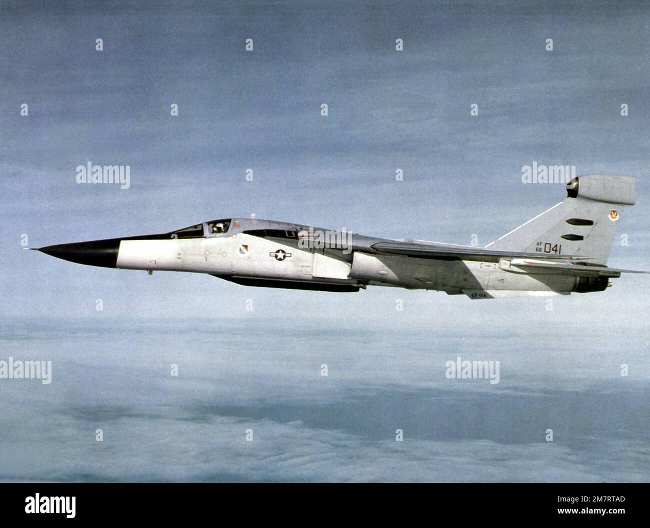 AN air-to-air left side view of an EF-111A tactical jamming system ...