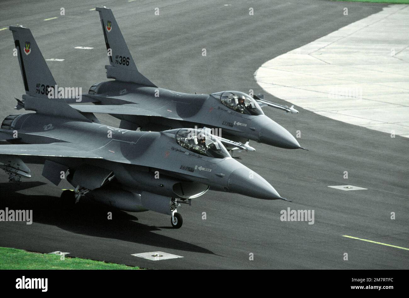 A view of two F-16A Fighting Falcon aircraft taxiing out. The aircraft ...
