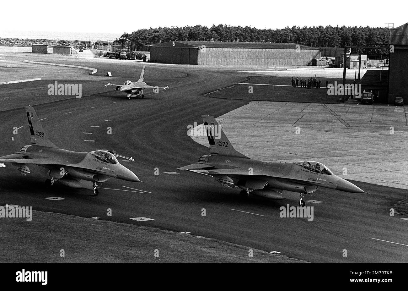 Three F-16 Fighting Falcon aircraft taxi out for a mission during the ...