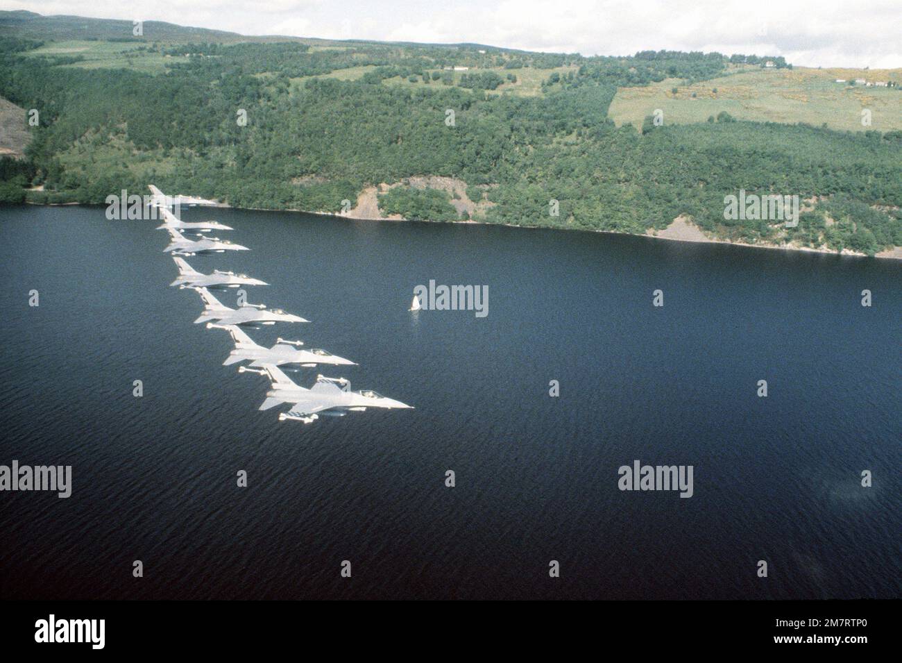 A right side view of a seven-ship echelon formation of F-16 Fighting ...