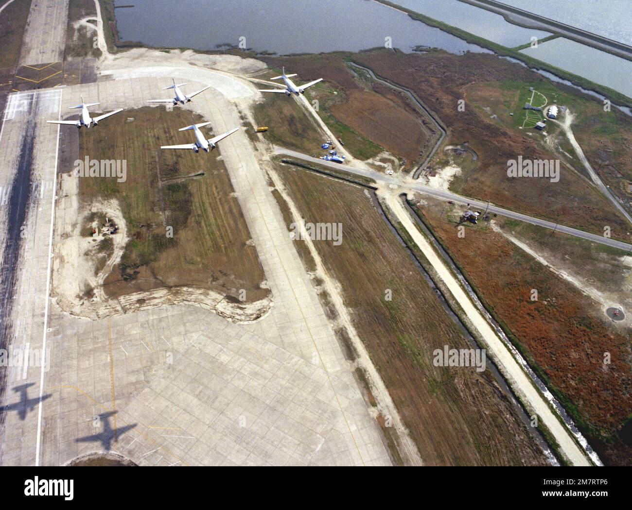 An air to ground view of four Marine C-117 aircraft as they fly over ...