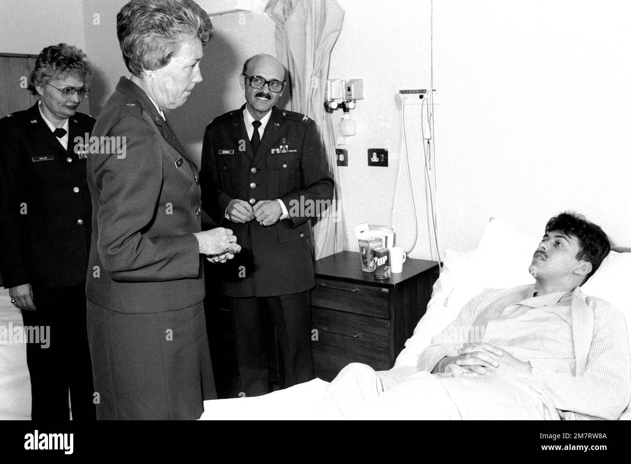 GEN Wells, chief nurse of the Air Force, talks to a patient during her ...