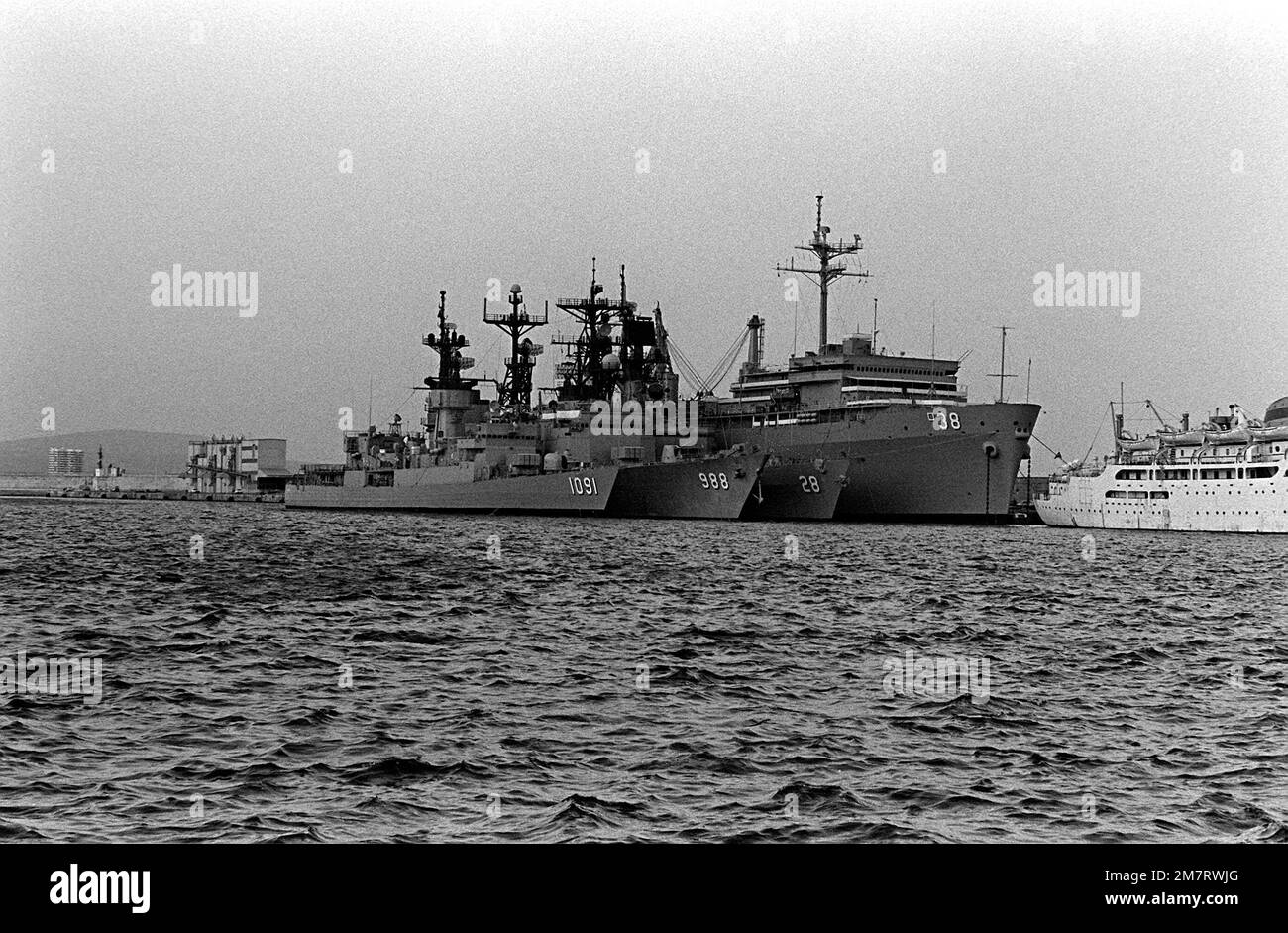 The U.S. 6th Fleet flagship, destroyer tender USS PUGET SOUND (AD-38), tends the guided missile ...