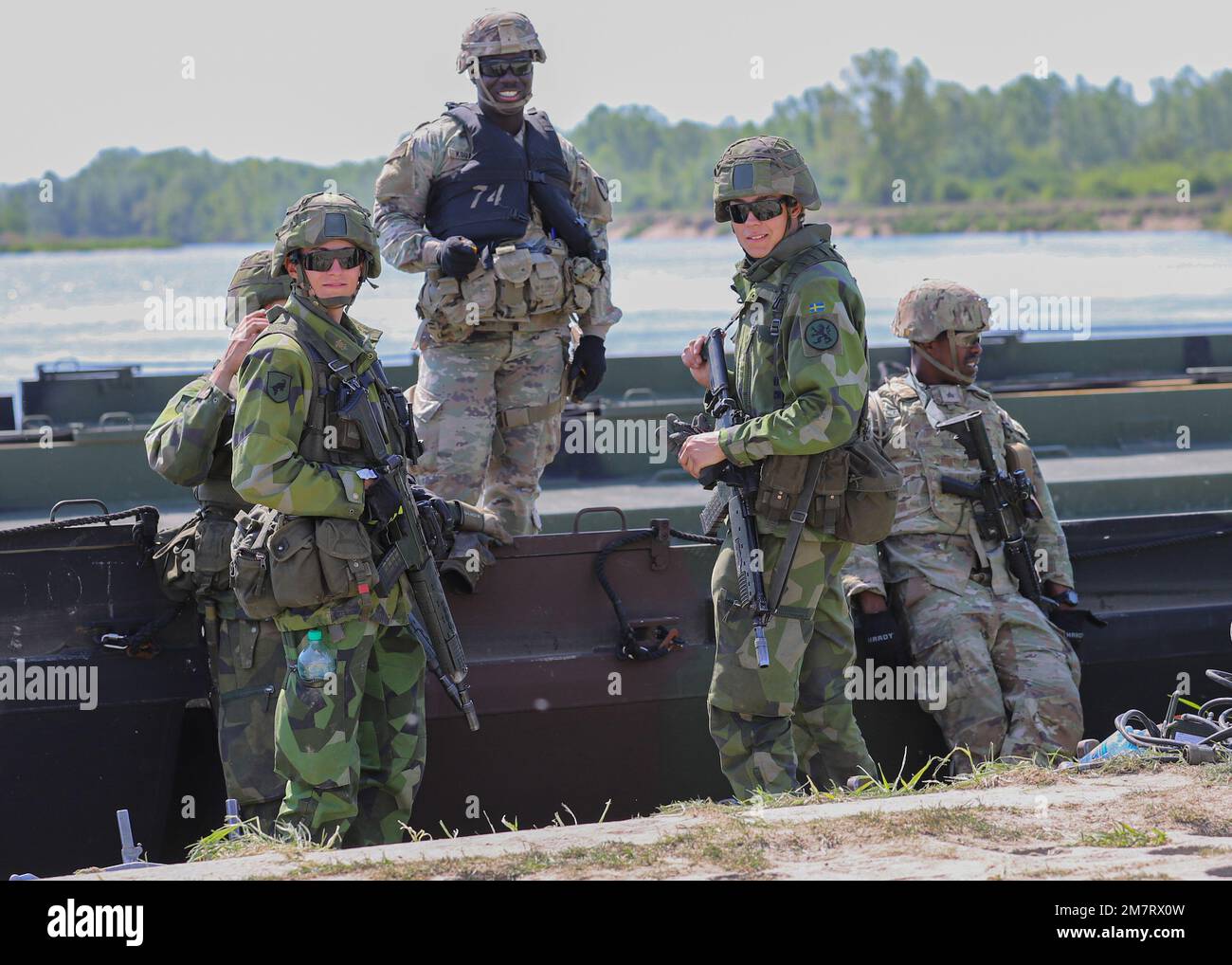 Swedish and U.S. Soldiers interact near the Vistula river during ...