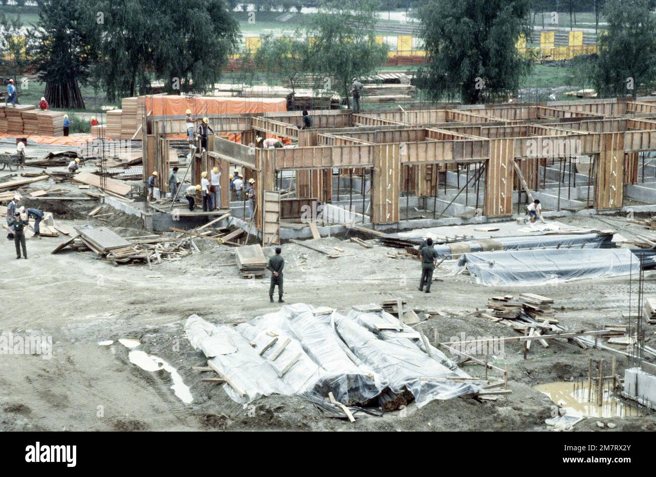 A view of enlisted dormitories under construction. Base: Suwon Air Base ...