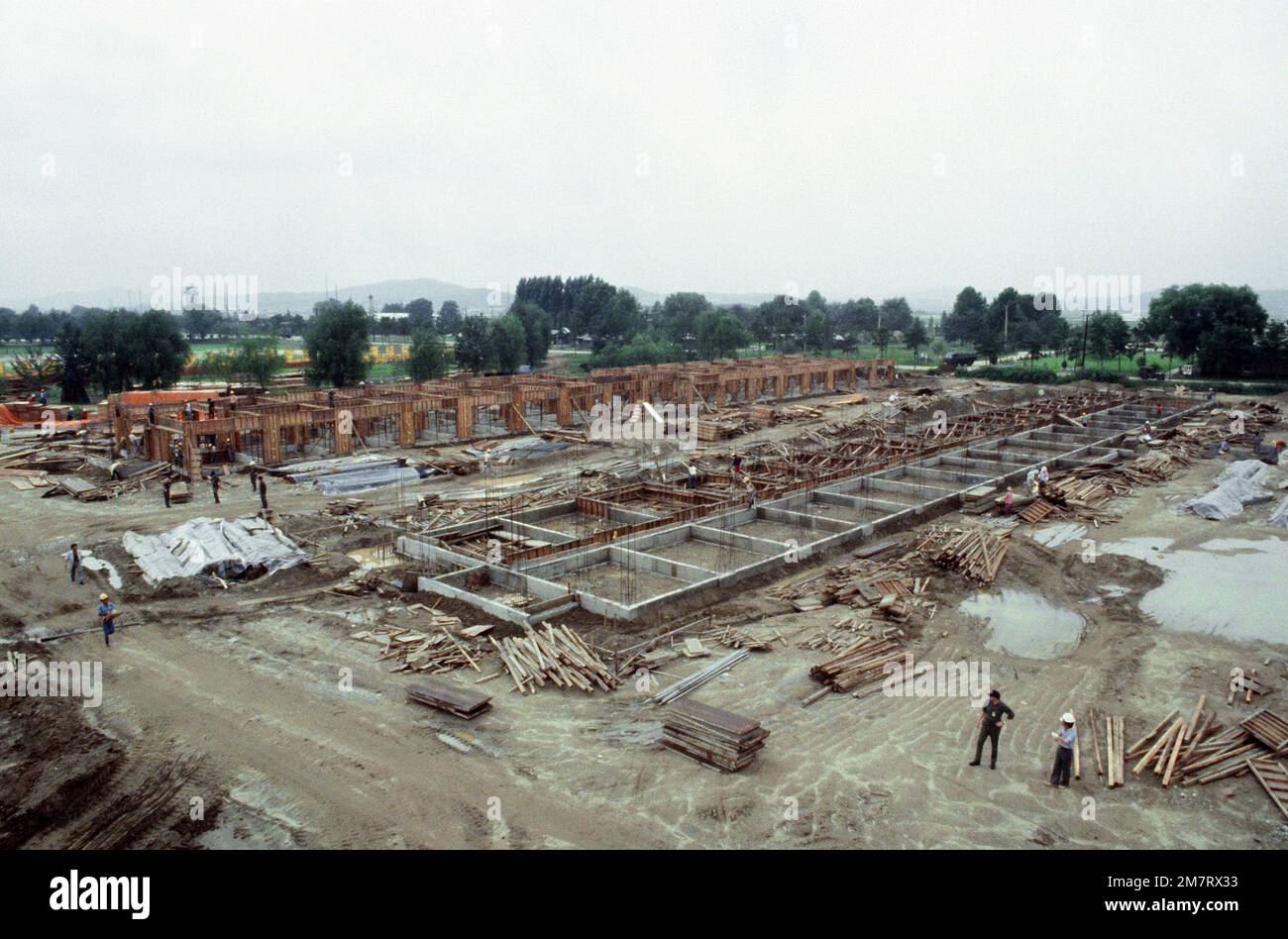 A view of enlisted dormitories under construction. Base: Suwon Air Base ...