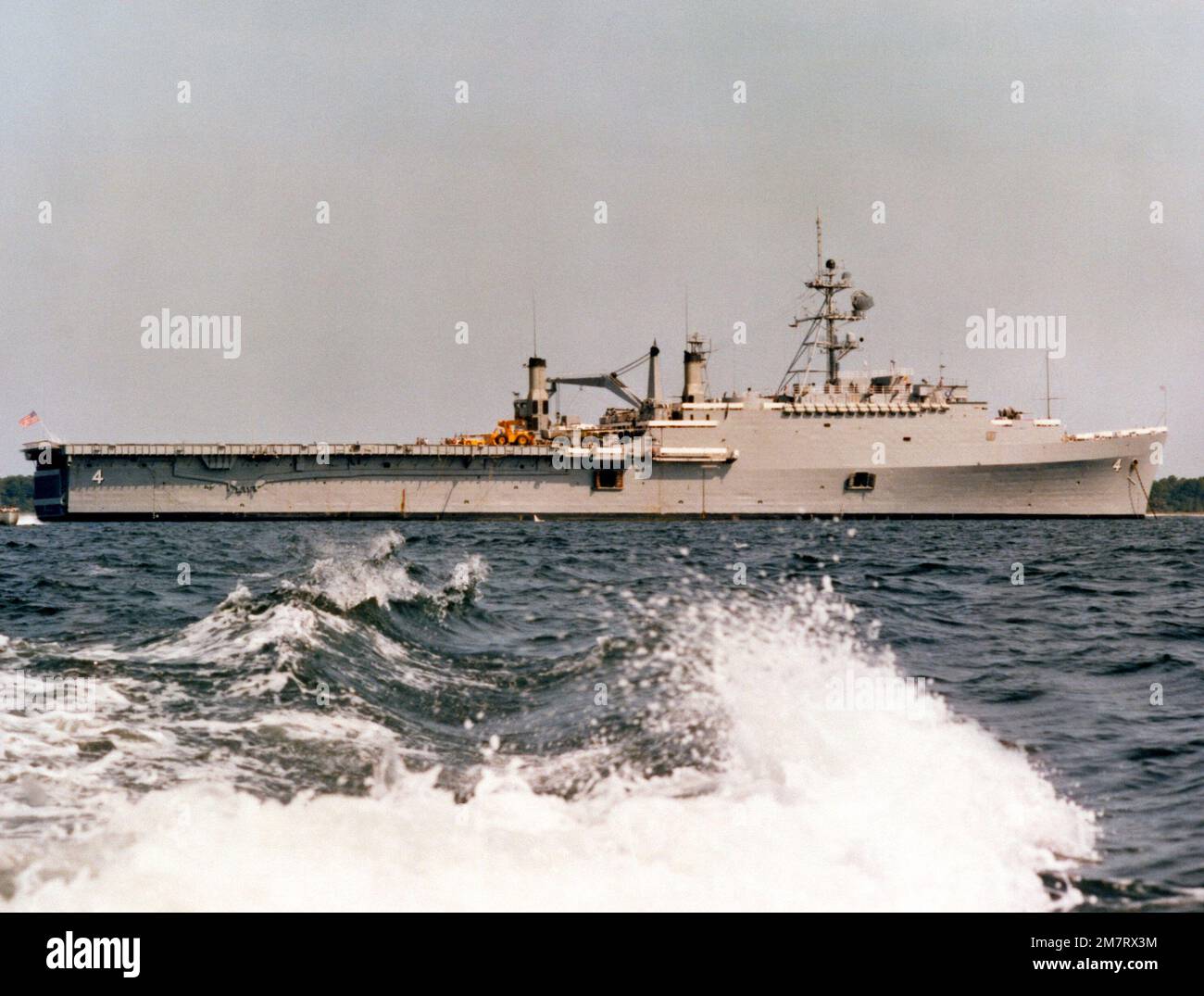 Starboard view of the anchored amphibious assault transport dock USS ...
