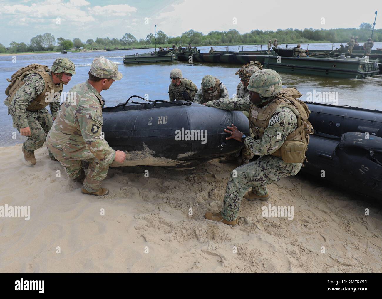 U.S. Soldiers begin to move their raft to the shore of the Vistula ...
