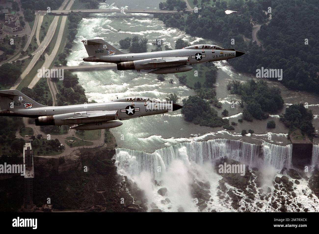 AN air-to-air right side view of two F-101 Voodoo aircraft over Niagara ...