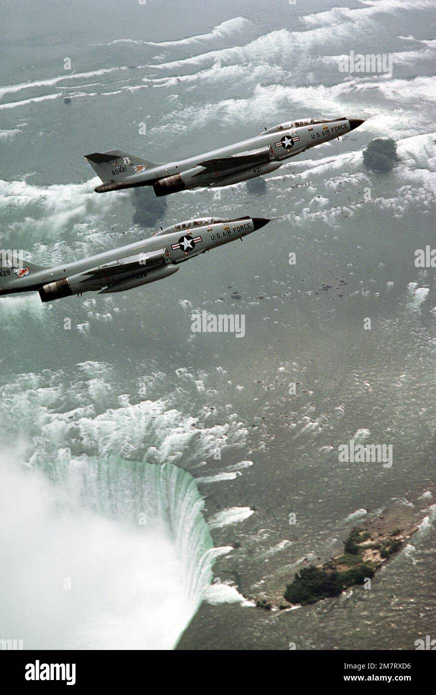 AN air-to-air right side view of two F-101 Voodoo aircraft over Niagara ...