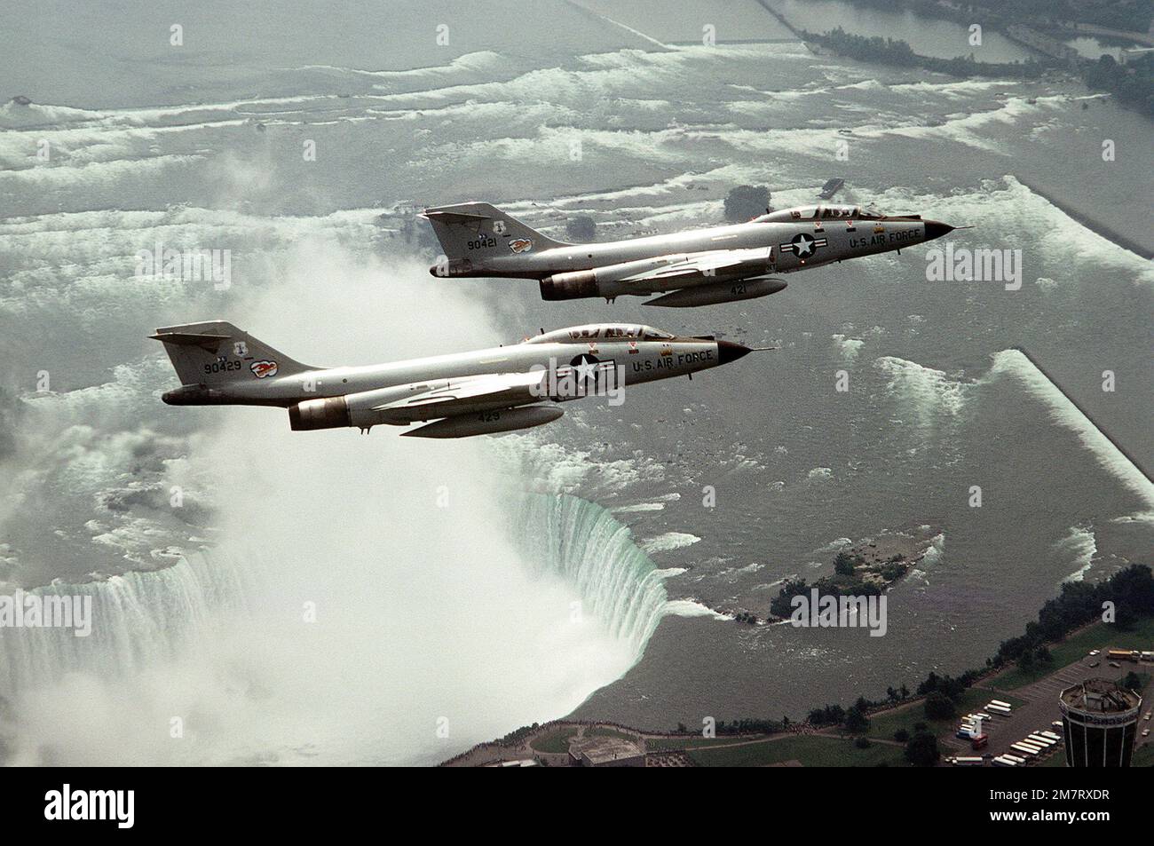 AN air-to-air right side view of two F-101 Voodoo aircraft over Niagara ...