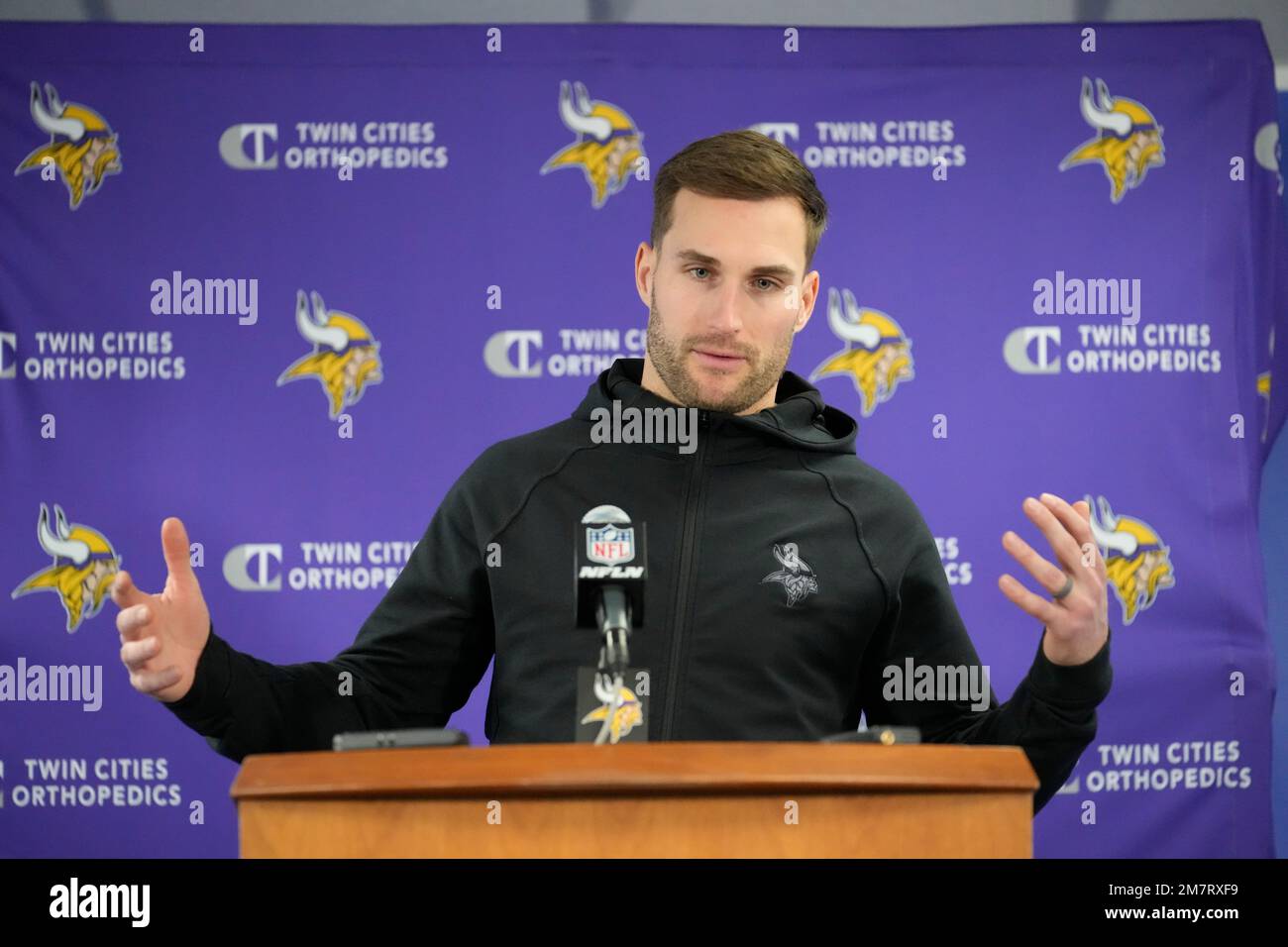Minnesota Vikings quarterback Kirk Cousins talks to reporters after an ...