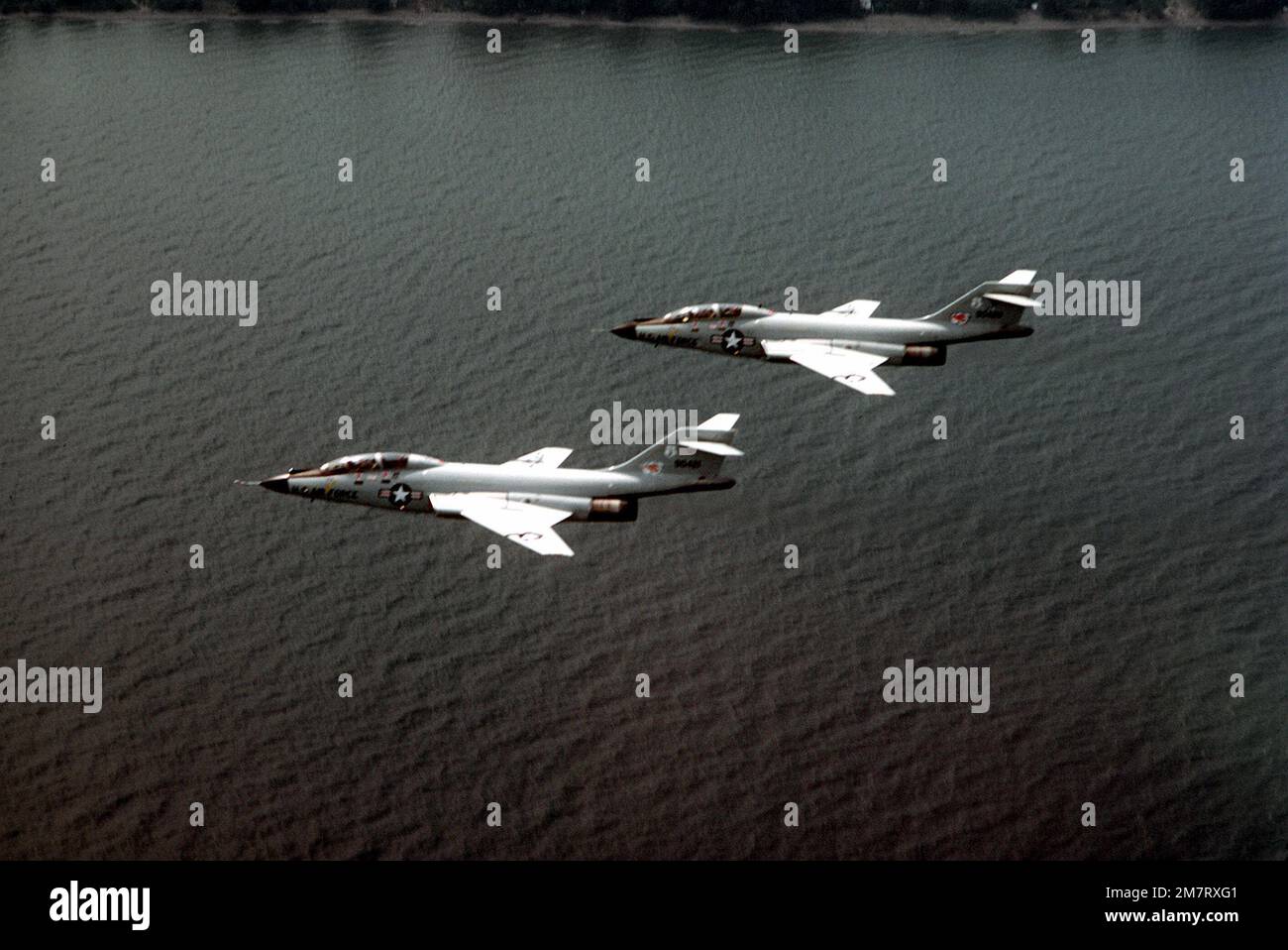 AN air-to-air left side view of two F-101 Voodoo aircraft near Niagara ...