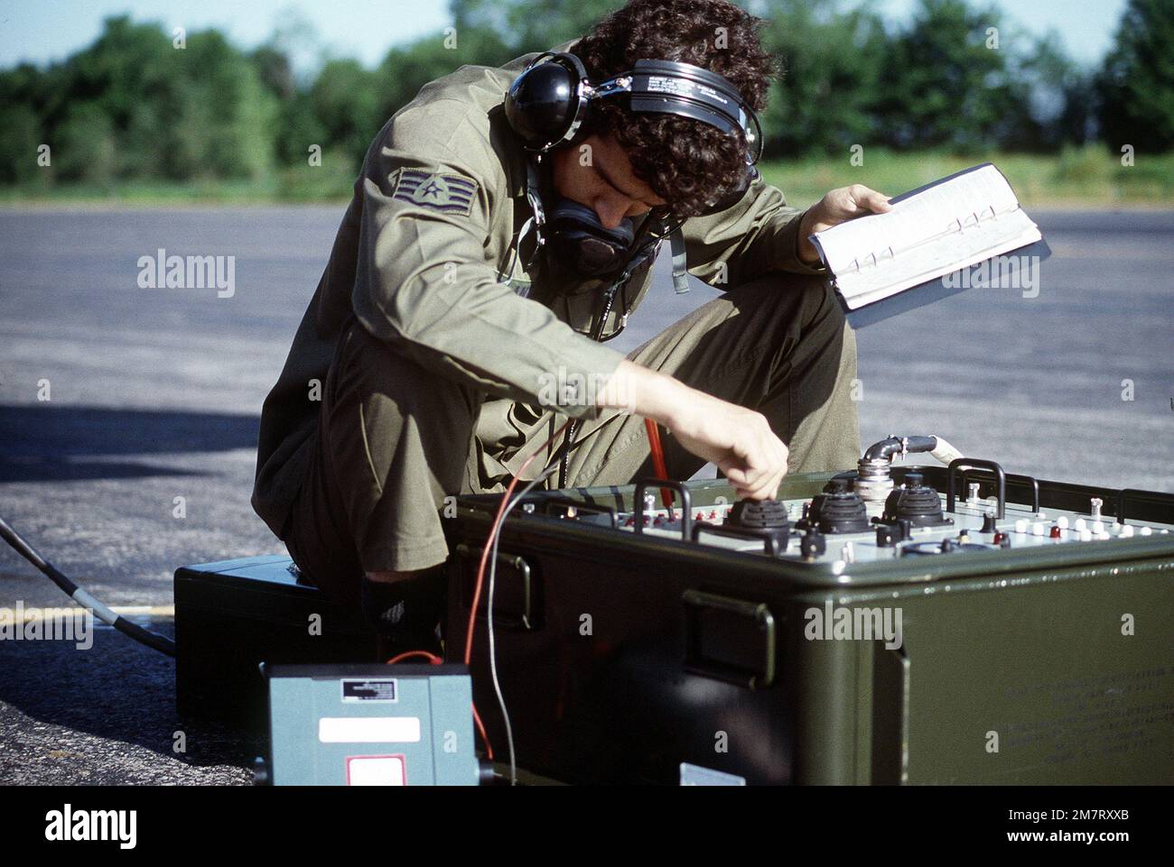 SSGT Bill Clancy, sensor technician, checks the Pave Penny system of an ...