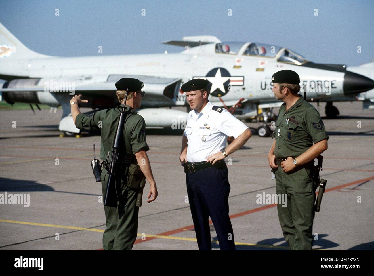 CPT Robert Baker, a security policeman, talks to this teammates during ...