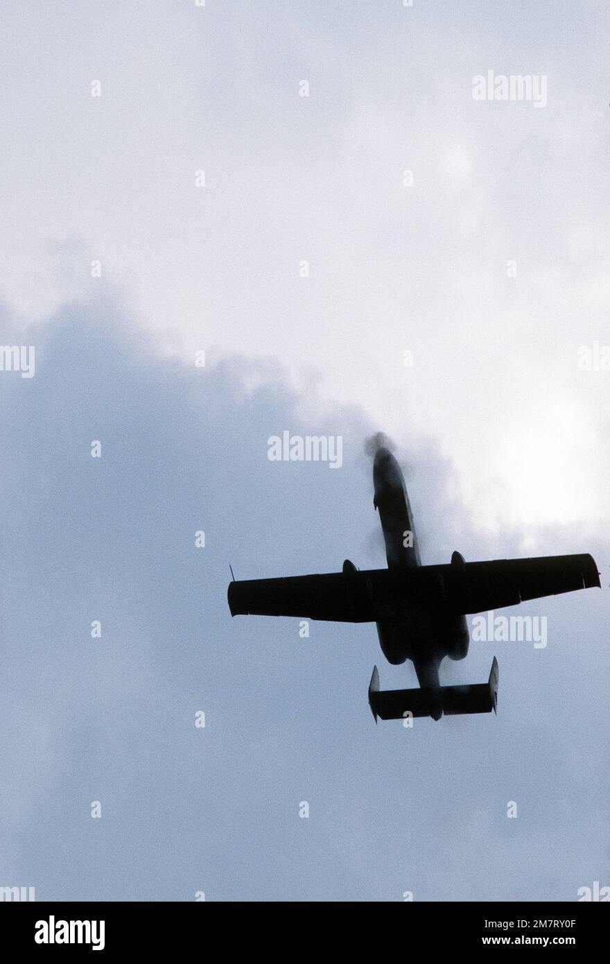 AN air-to-air underside view of an A-10 Thunderbolt II aircraft during ...