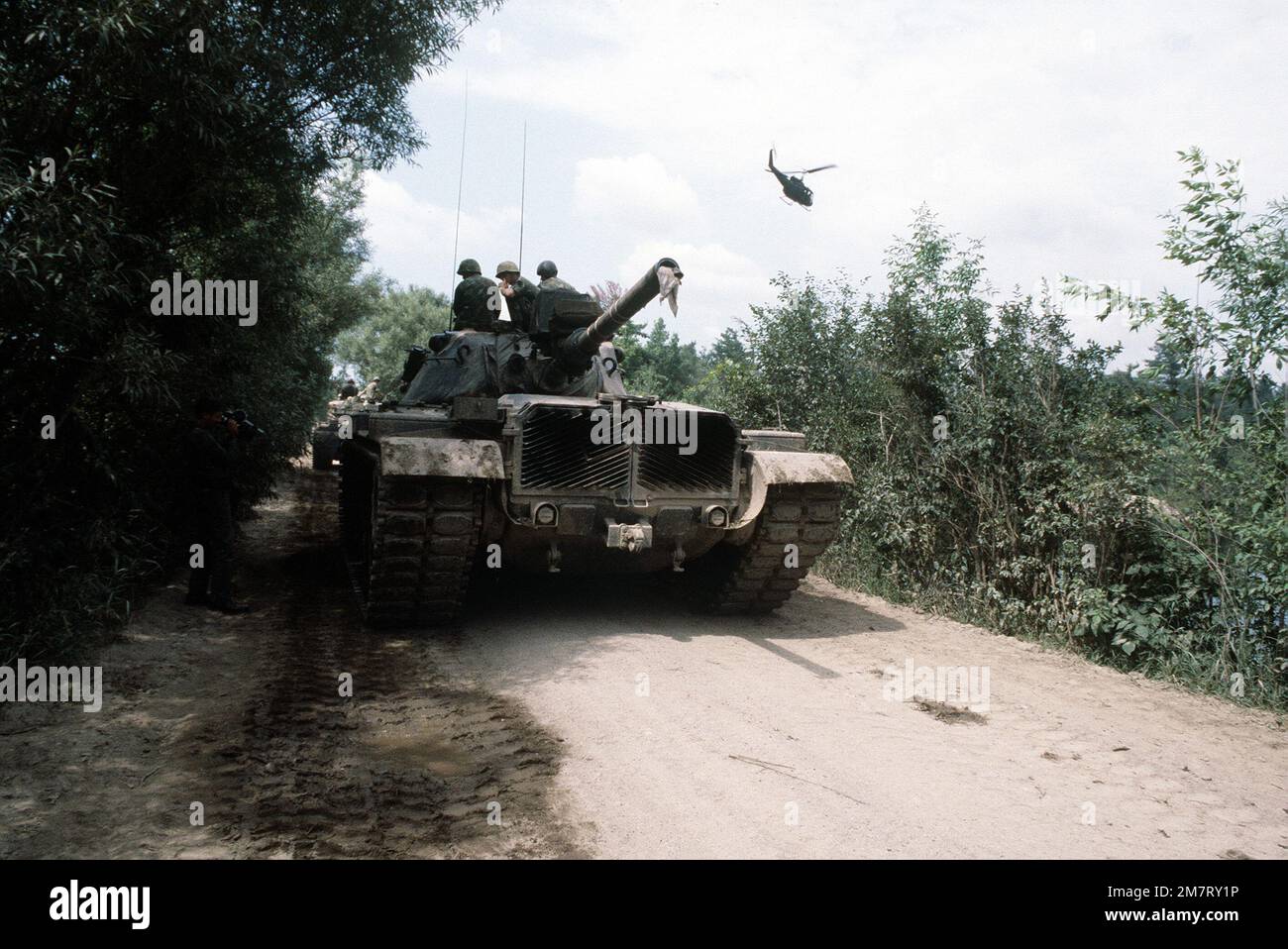An Air Force motion picture photographer documents a convoy of M-60 ...