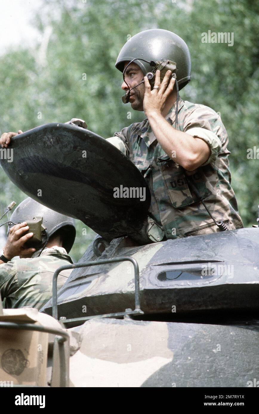 Marines aboard an aggressor forces M-60 tank maneuver through a field ...