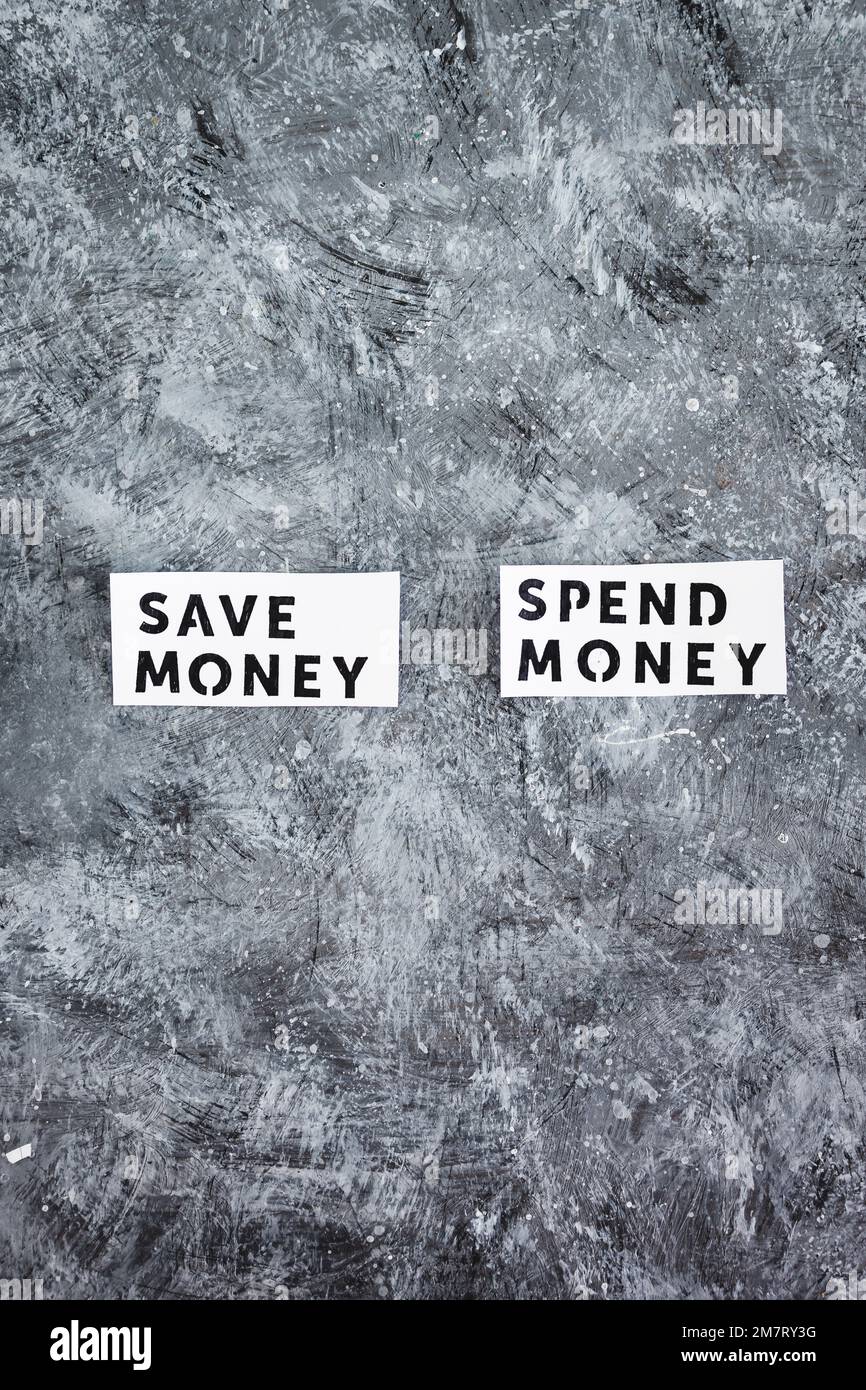 save money and spend texts on grey background, concept of financial ...