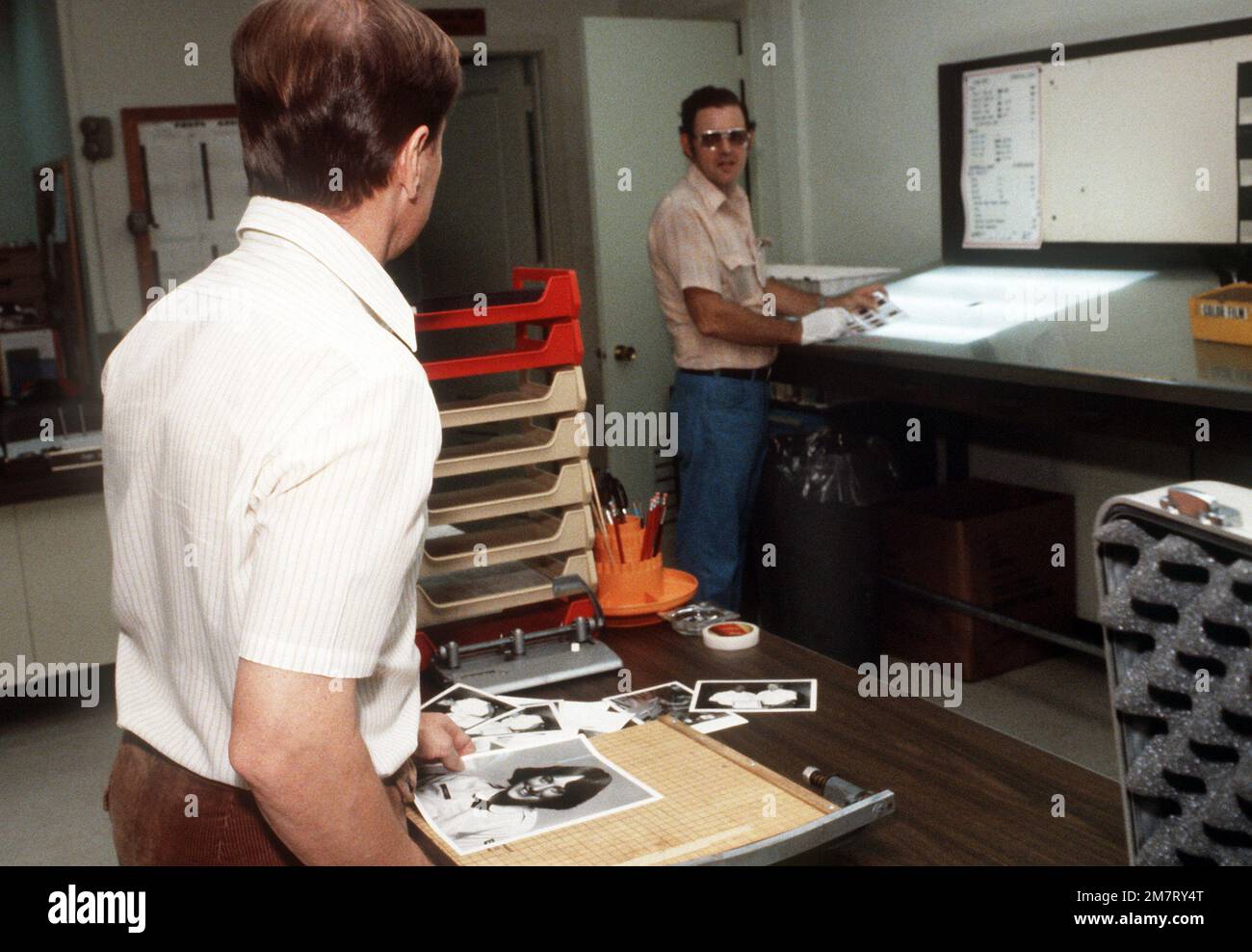 Charles Wall (foreground) and Wayne Dunn work in the finishing and ...