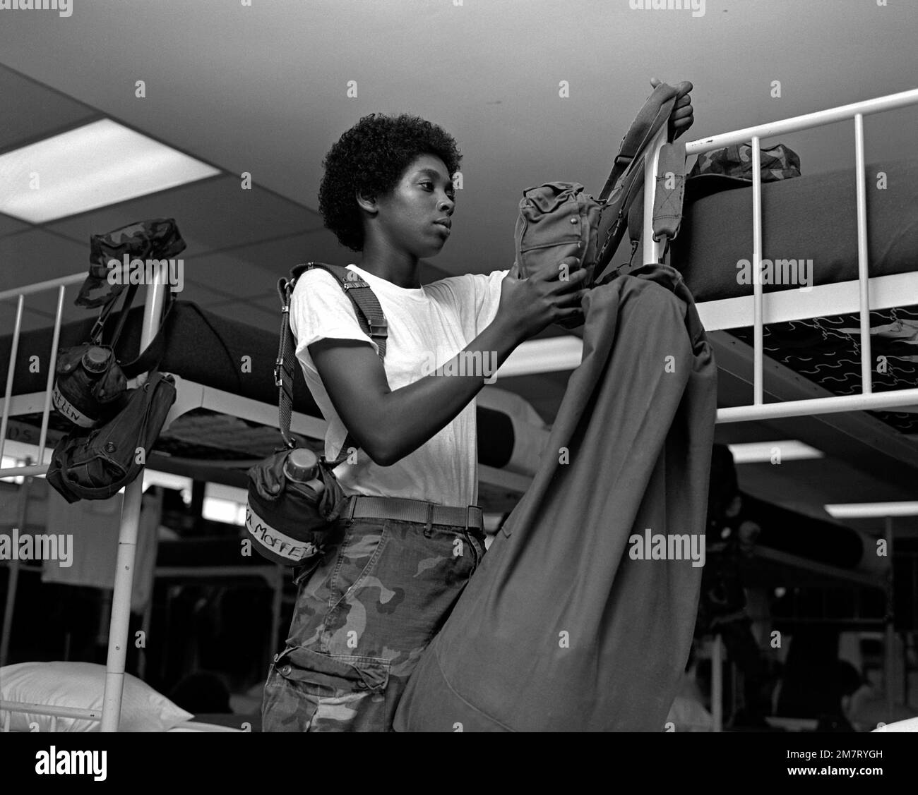 PVT B. J. Gatlin of Series 10a, Company K, hangs her partially-filled ...