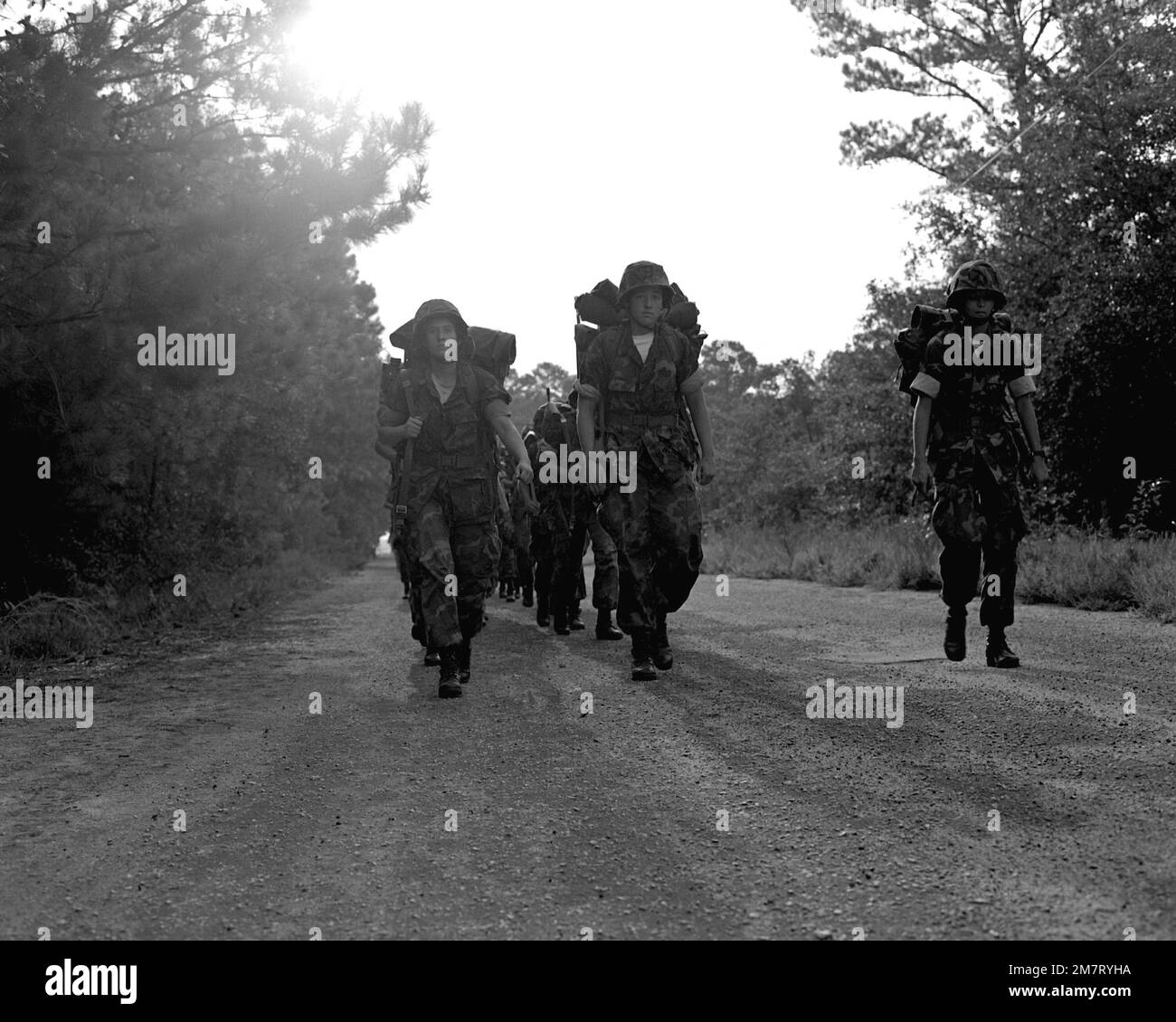 A woman Marine recruit platoon from Series 10, Company K, marches back ...