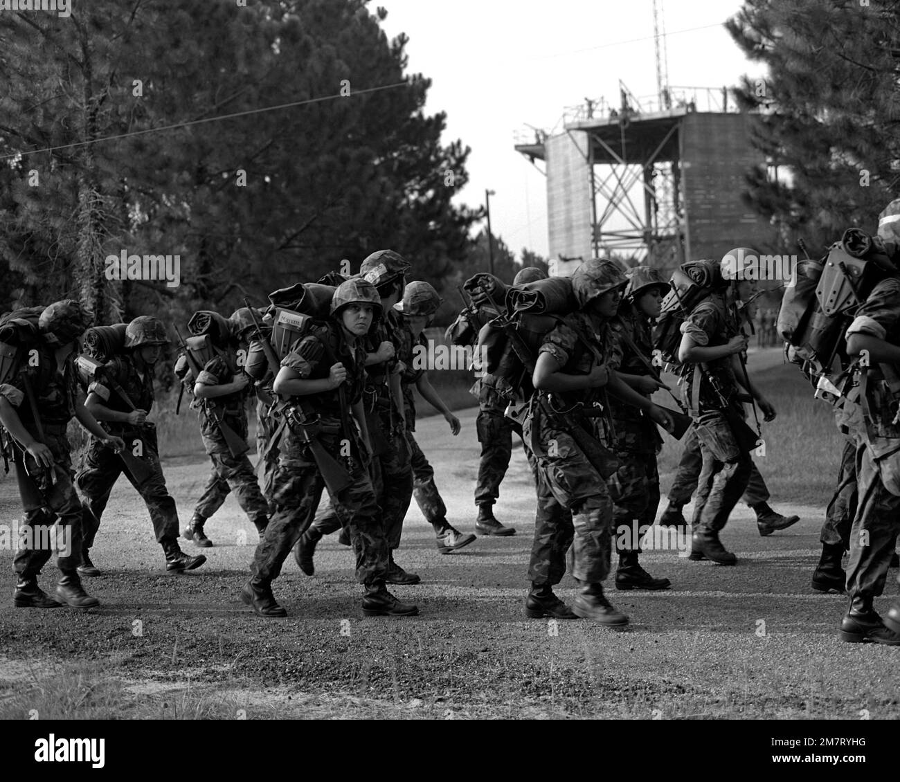 A woman Marine recruit platoon from Series 10, Company K, marches back ...