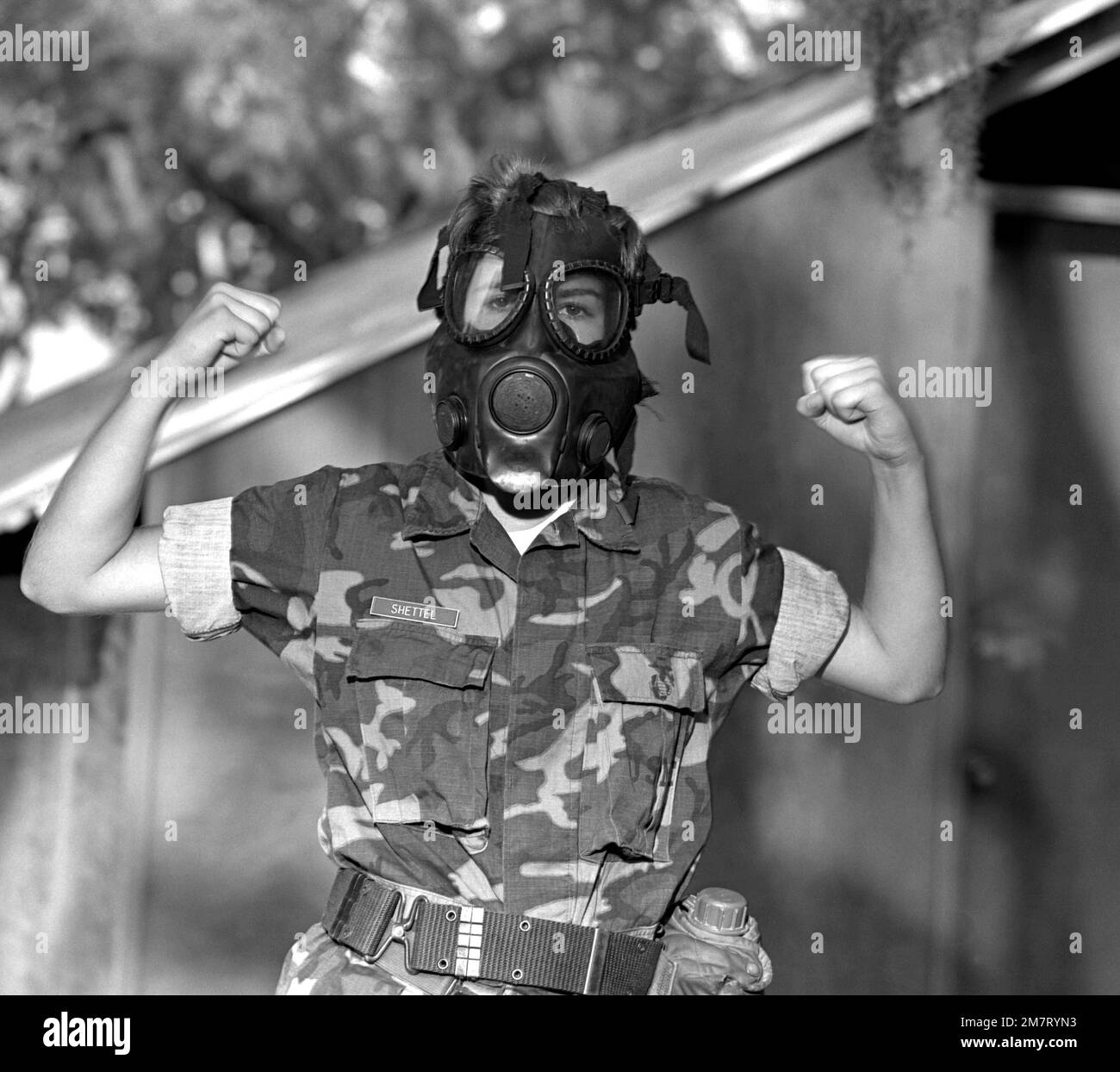 PVT Shettel of Series 9a gives the arm and hand signal for a gas alert ...