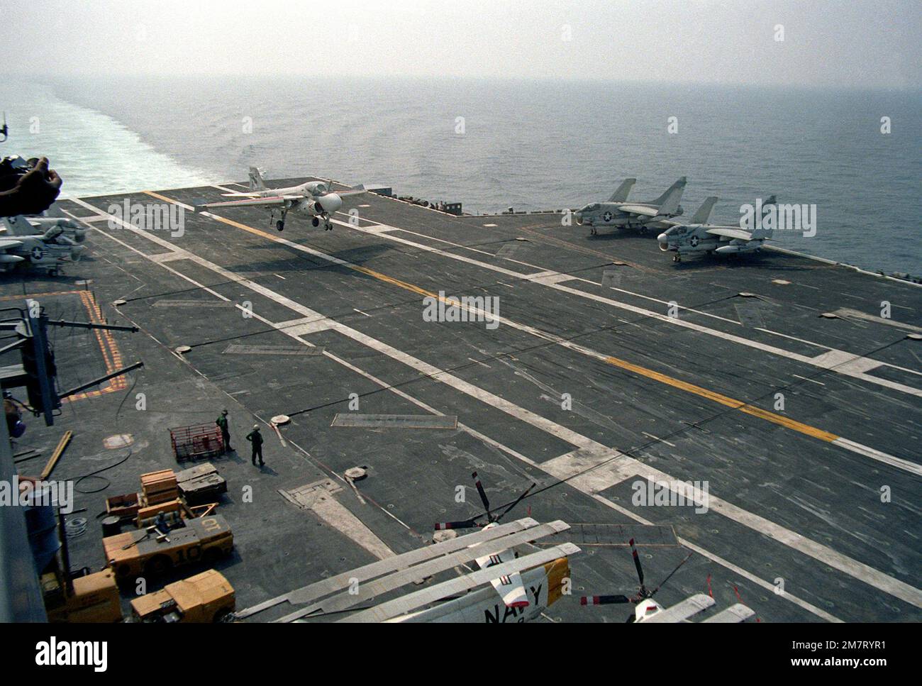 An A-6 Intruder aircraft comes in for recovery aboard the nuclear-powered aircraft carrier USS ...