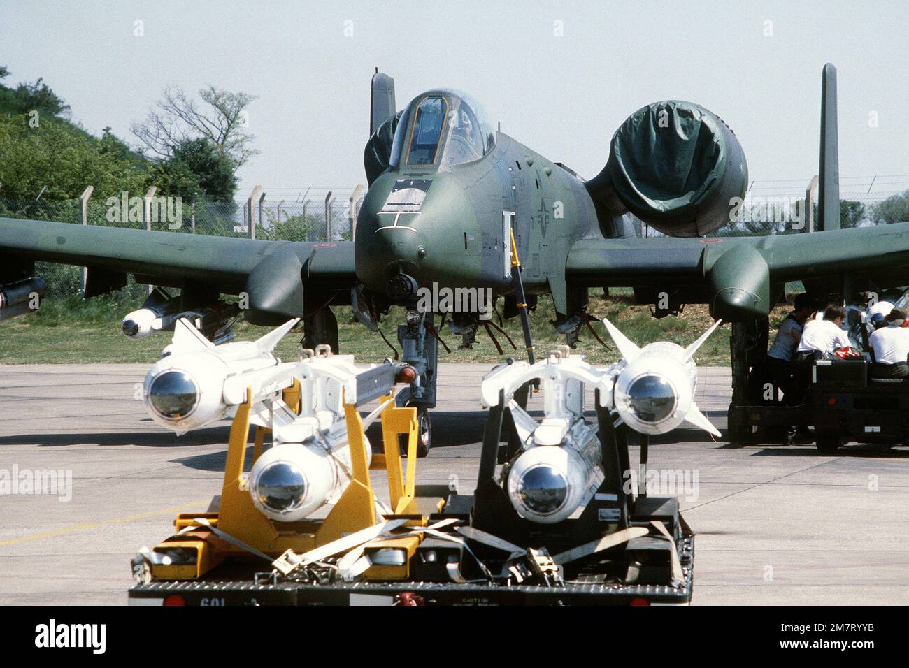 A front view of an A-10 Thunderbolt II aircraft being uploaded with AGM ...