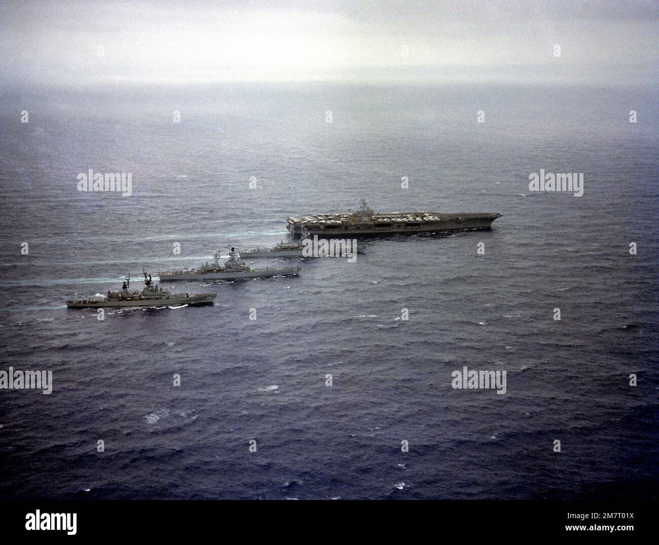 Aerial starboard view of (left to right) the guided missile cruiser USS ...