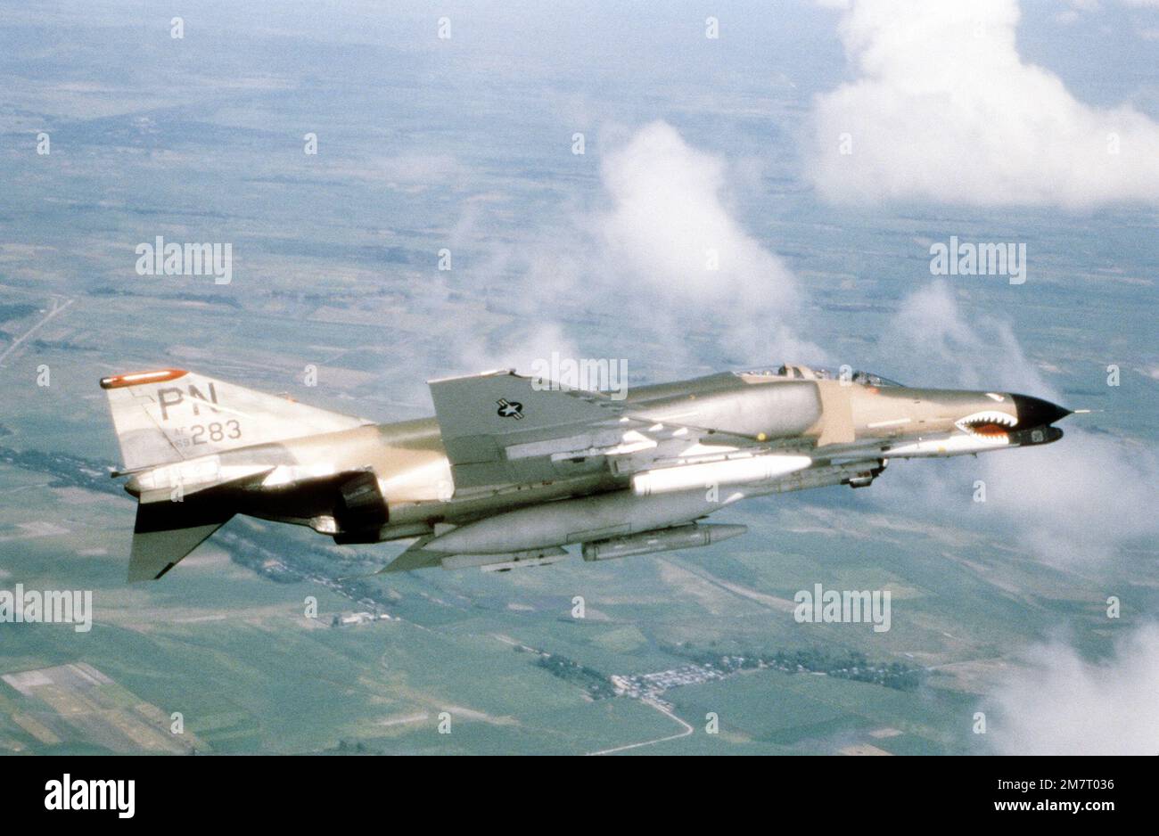 AN air-to-air right side view of an F-4 Phantom II aircraft. Base ...