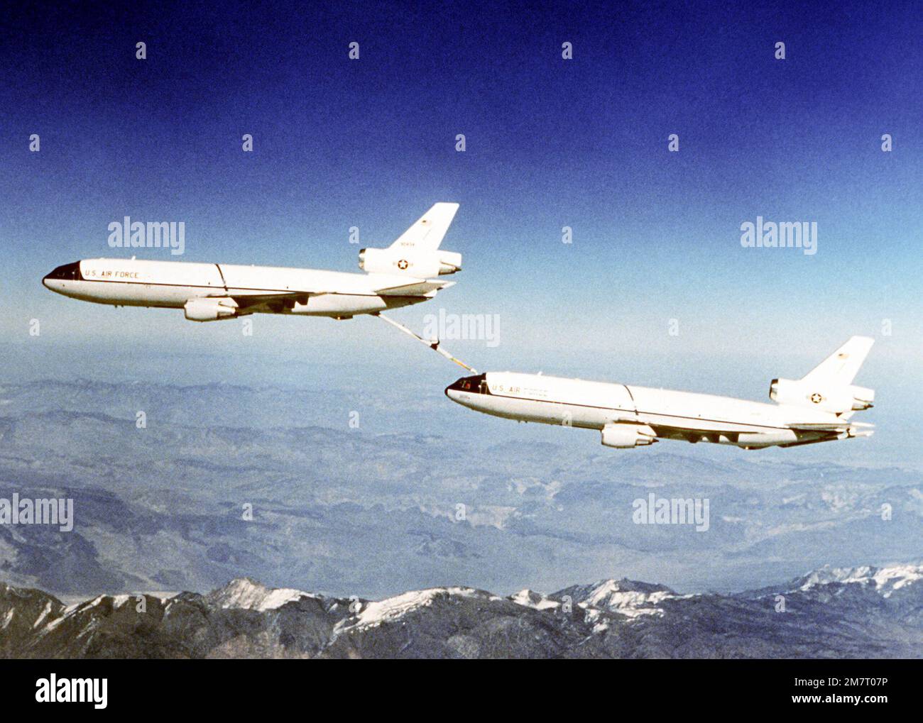 An air-to-air right side view of a KC-10 Extender aircraft being ...