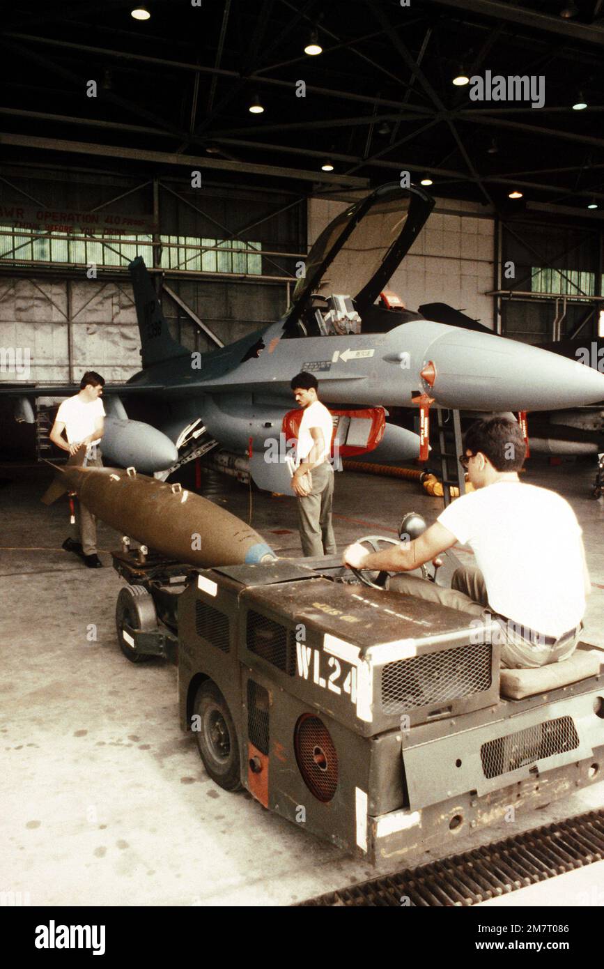 SRA Kevin McGuire from the 8th Tactical Fighter Wing, drives a bomb ...