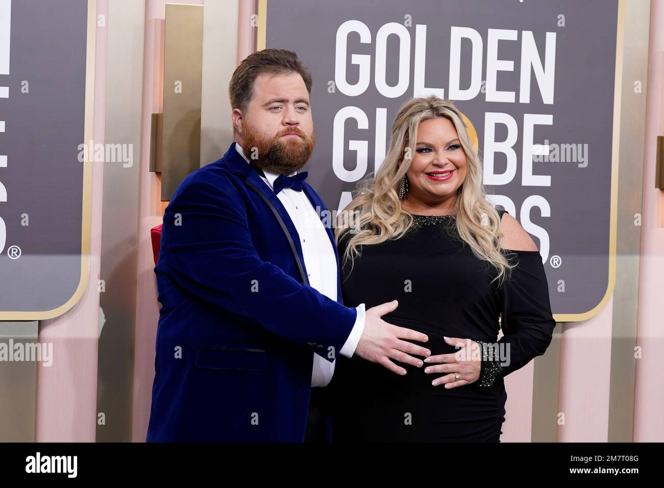 Paul Walter Hauser, left, and Amy Boland Hauser arrive at the 80th ...