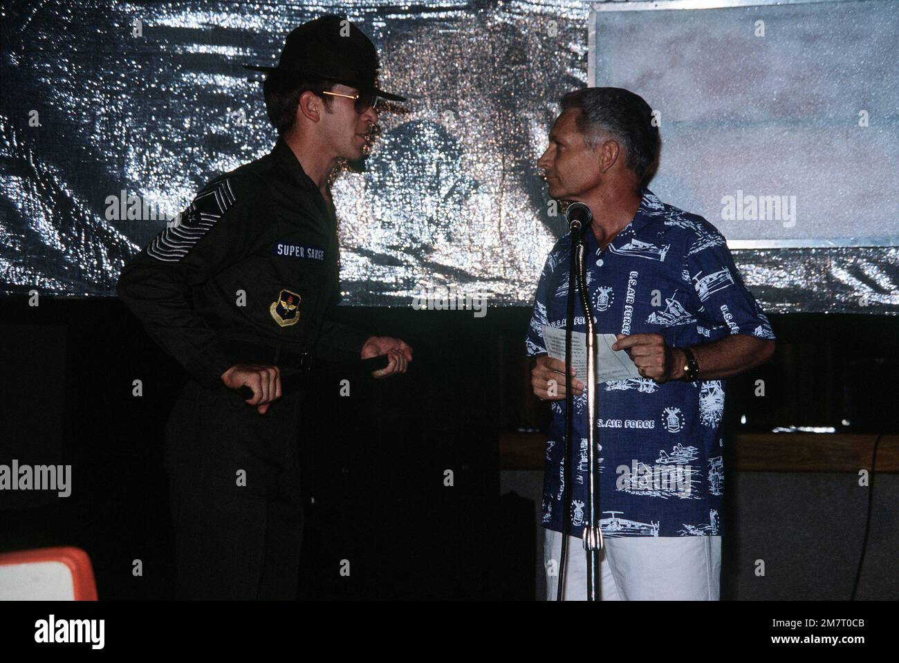 COL Leland Small, 475th Air Base Wing vice-commander, is interrupted by ...